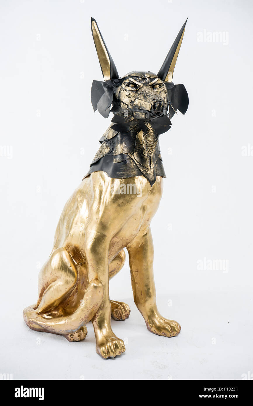 sculpture of the Egyptian god Anubis, gold figure and black jackal ...