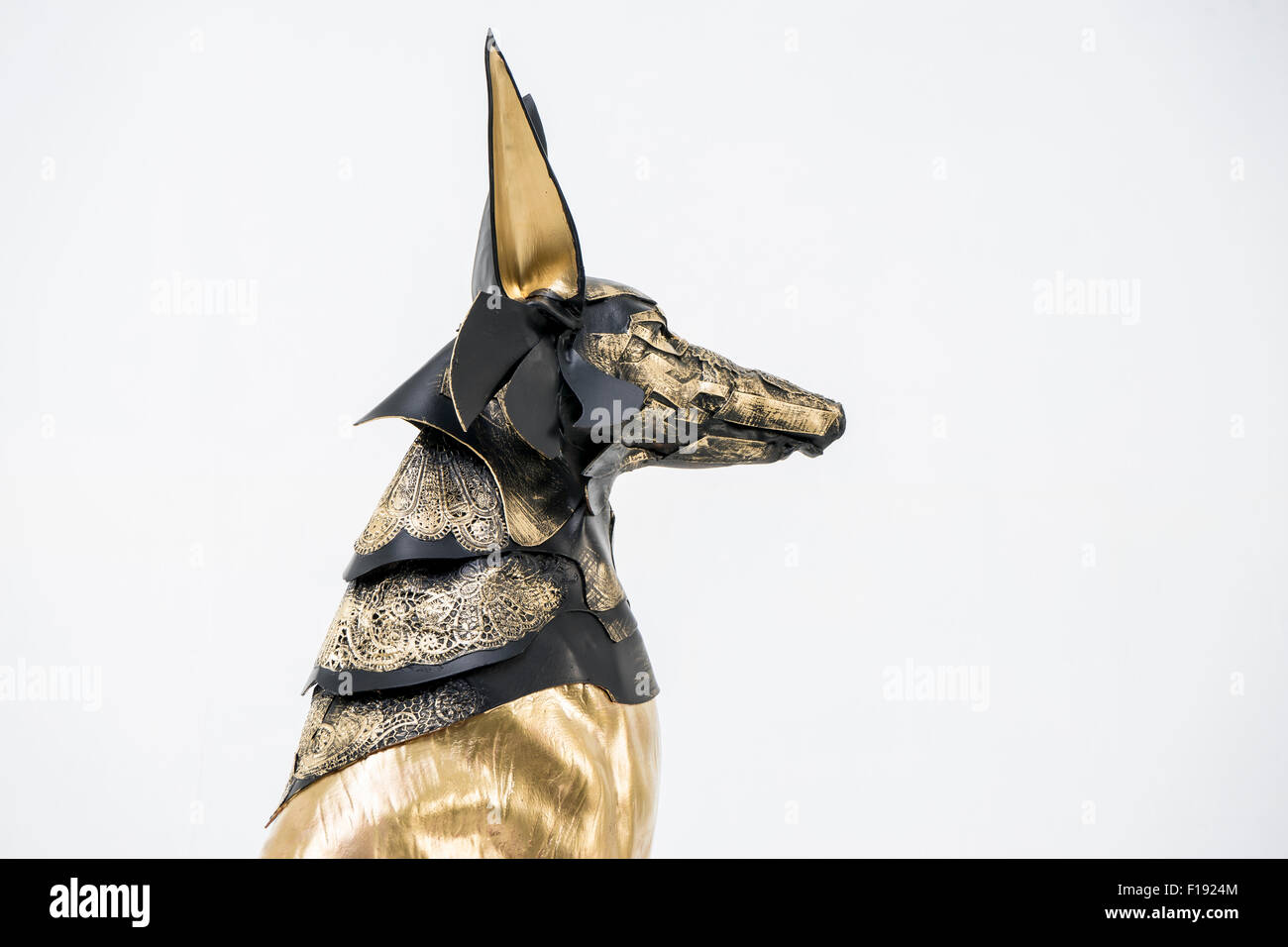 sculpture of the Egyptian god Anubis, gold figure and black jackal ...