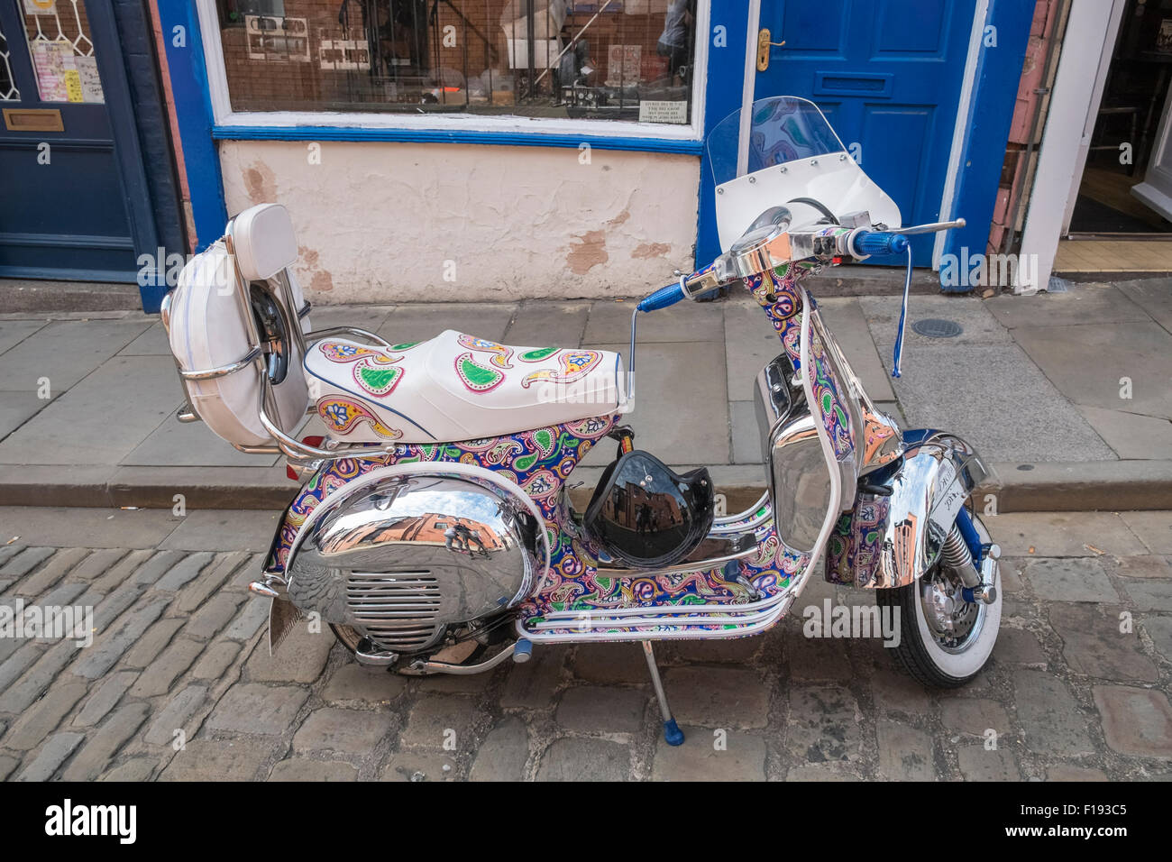 Customised paisley patterned decorative Vespa scooter standing on ...