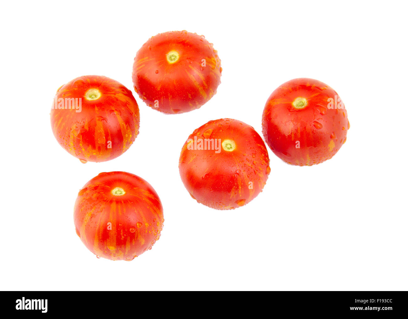 Five cherry tomatoes isolated on white background Stock Photo - Alamy