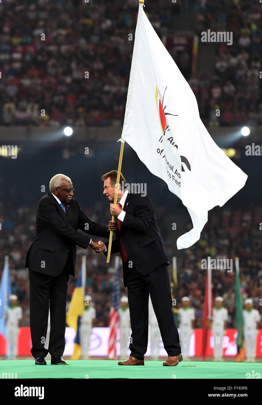 Beijing, China. 30th Aug, 2015. IAAF president Lamine Diack (L) hands ...
