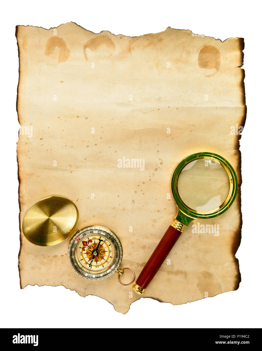 Old grunge blank paper sheet with compass and glass Stock Photo - Alamy