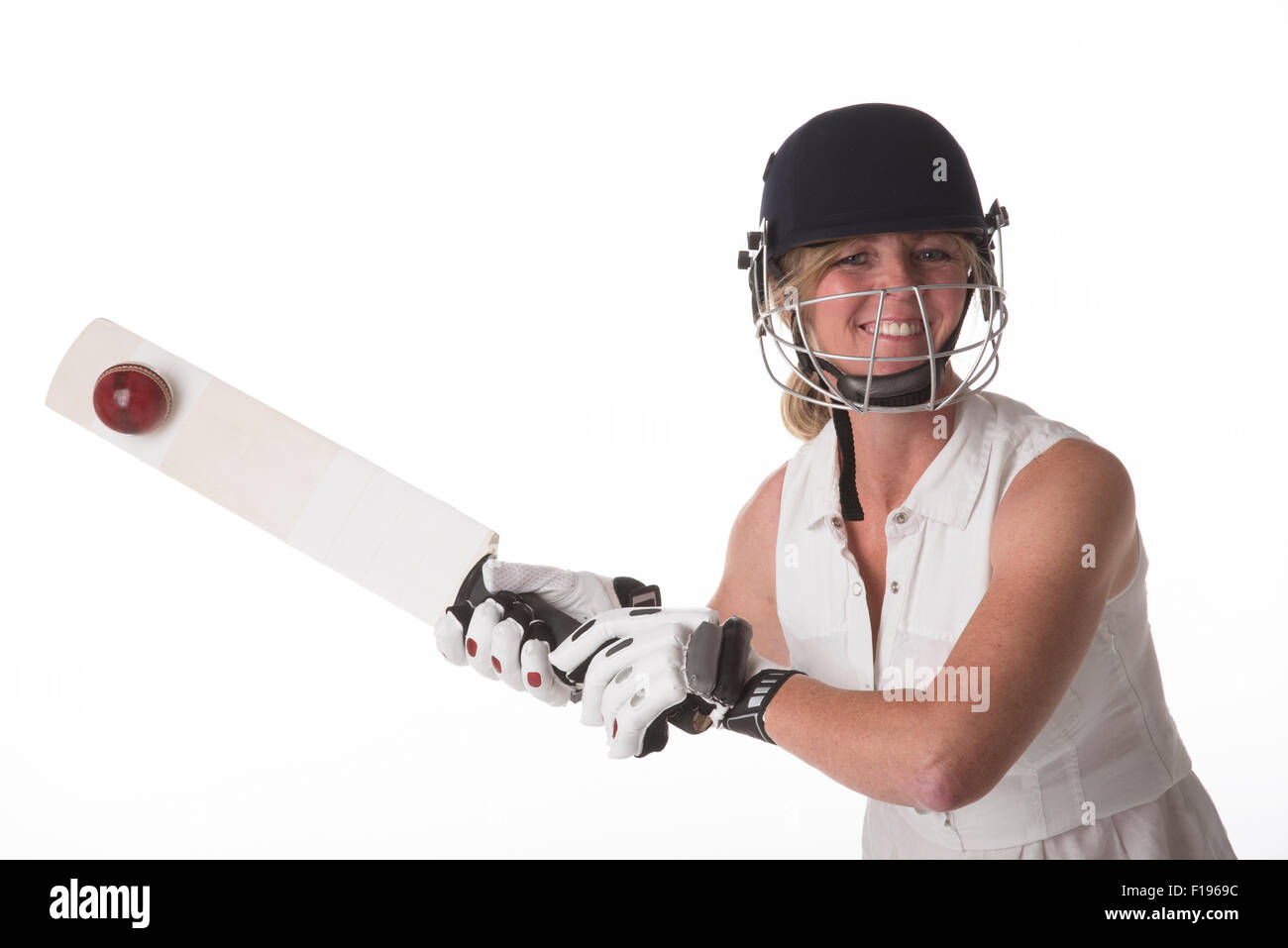 Female club cricket player hitting cricket ball with a bat cricket ...