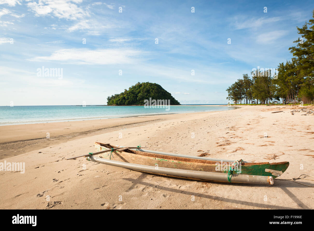 Small fishing boat exotic beach Stock Photo - Alamy