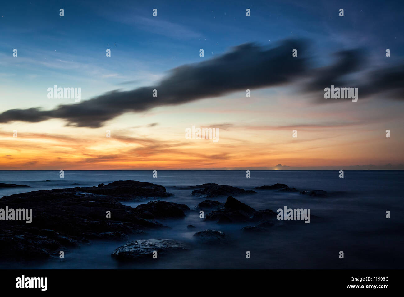 Long exposure night waterscape and vibrant sky Stock Photo - Alamy