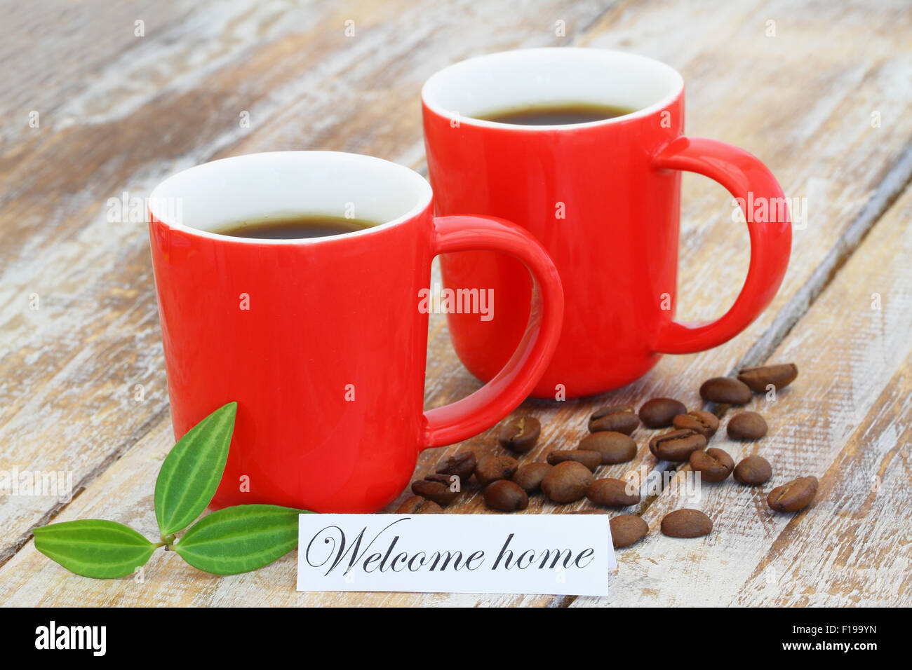 Welcome home card with two red mugs of coffee Stock Photo - Alamy