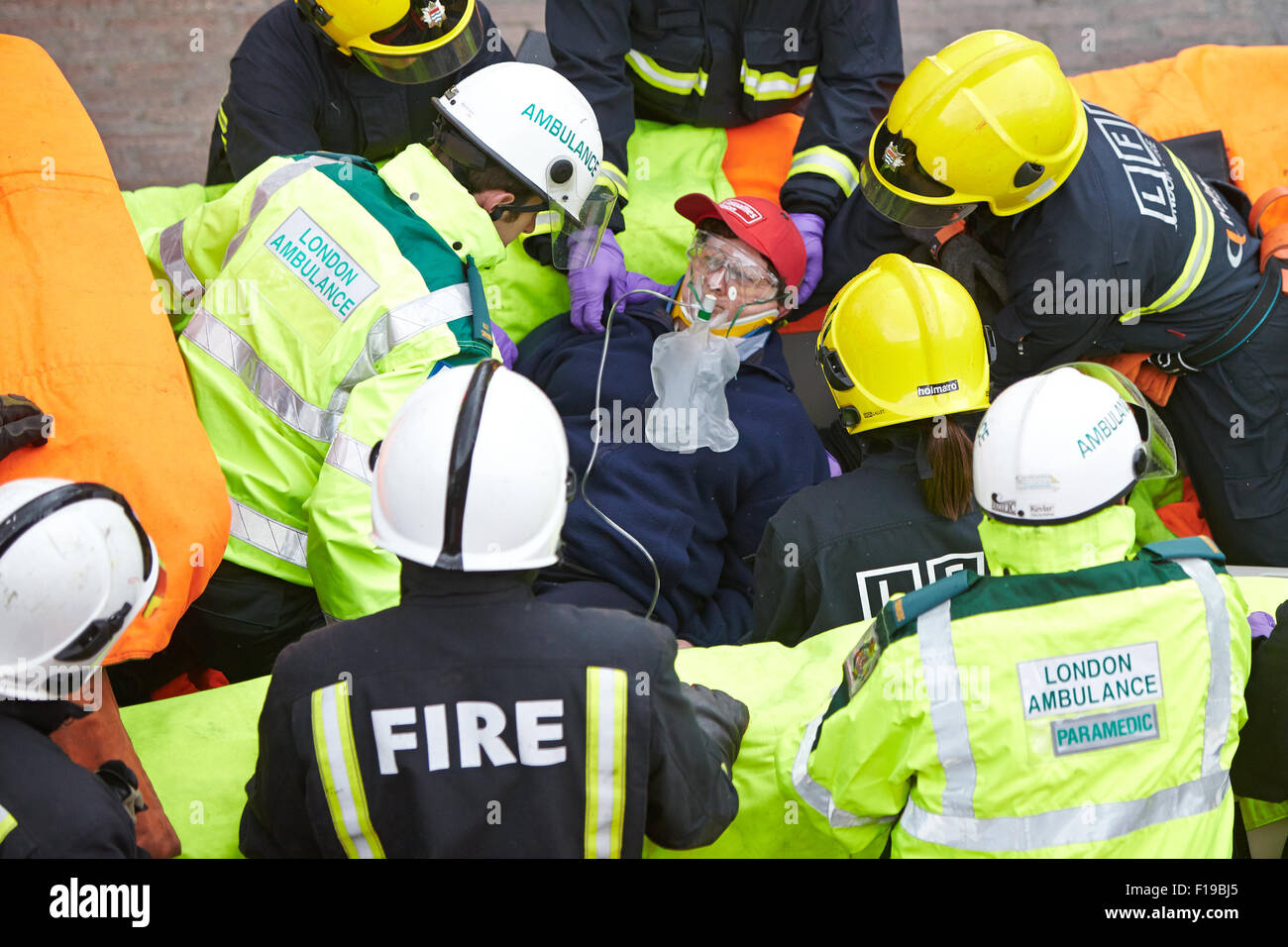 The London Fire Brigade extraction team demonstrate rescuing simulated ...