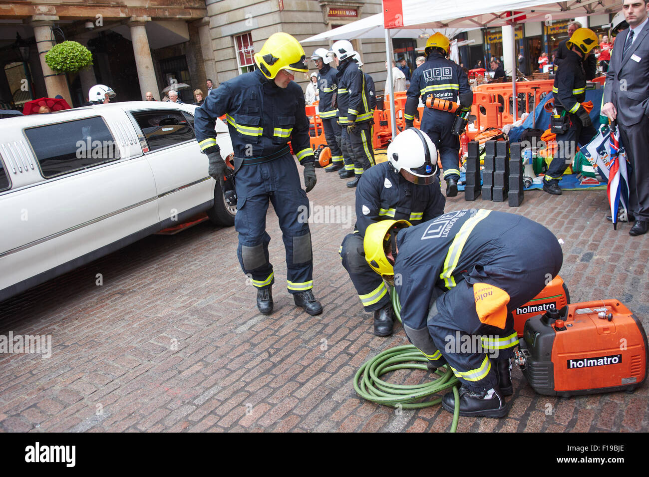 The London Fire Brigade extraction team demonstrate rescuing simulated ...