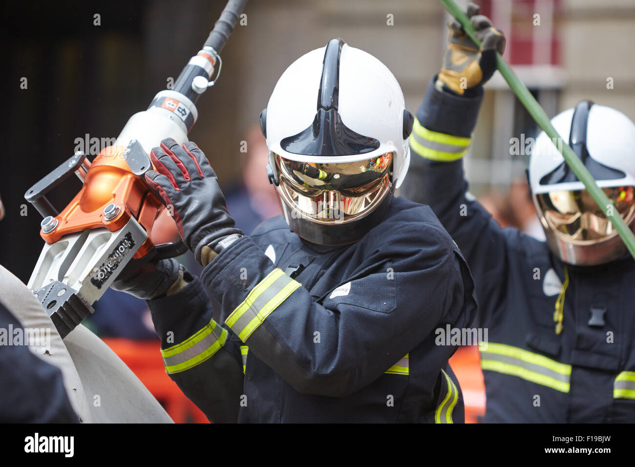 The London Fire Brigade extraction team demonstrate rescuing simulated ...