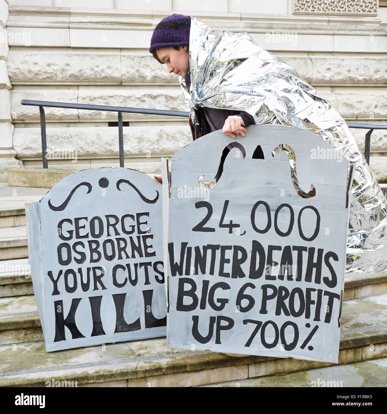 Activists from Fuel Poverty Action protest outside the Treasury ...