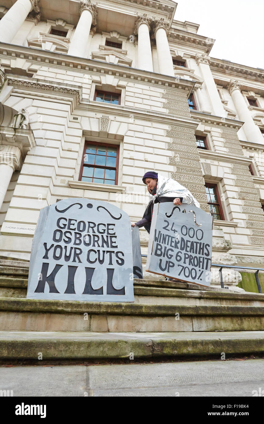 Activists from Fuel Poverty Action protest outside the Treasury ...