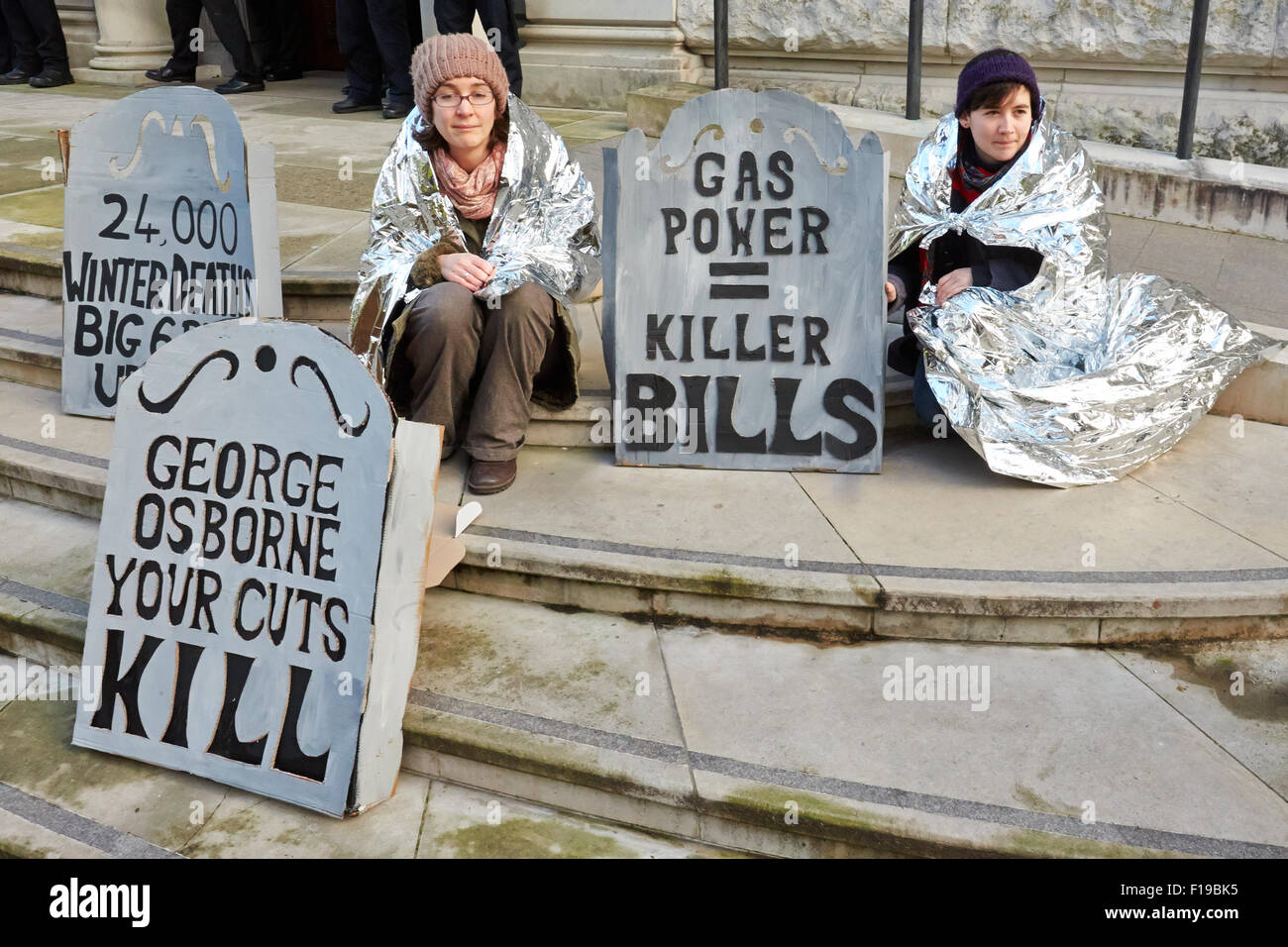 Activists from Fuel Poverty Action protest outside the Treasury ...