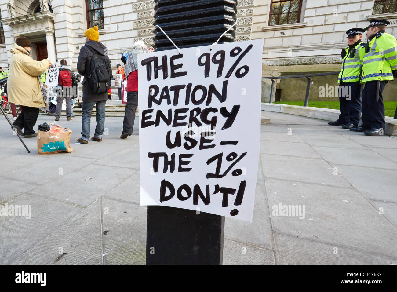 Activists from Fuel Poverty Action protest outside the Treasury ...