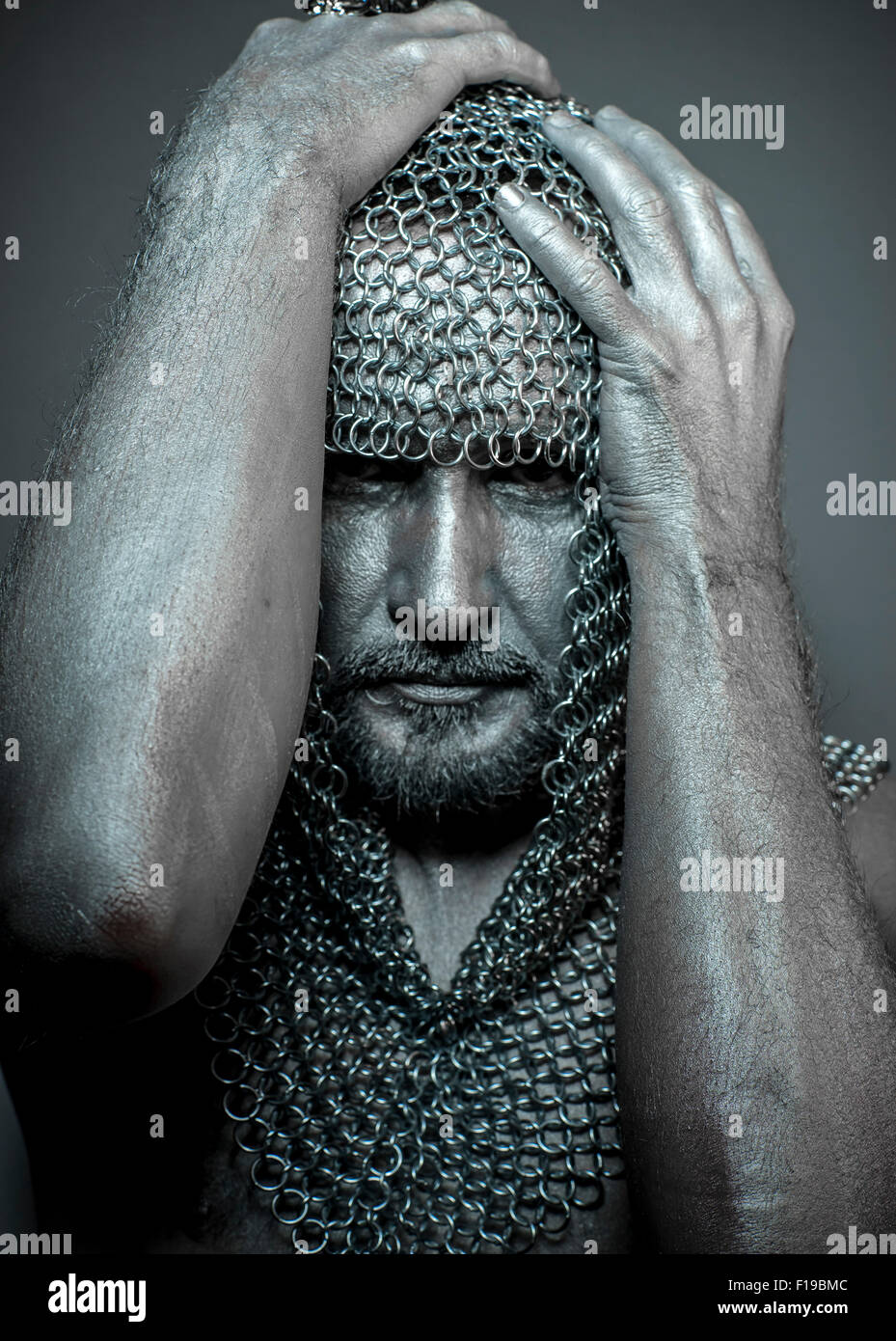 Warrior, medieval executioner mesh iron rings on the head Stock Photo ...