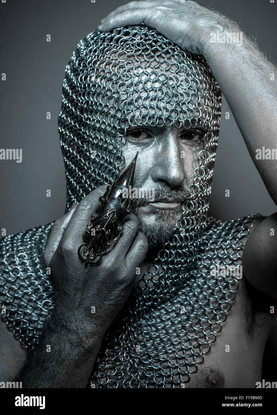 Murder, medieval executioner mesh iron rings on the head Stock Photo ...