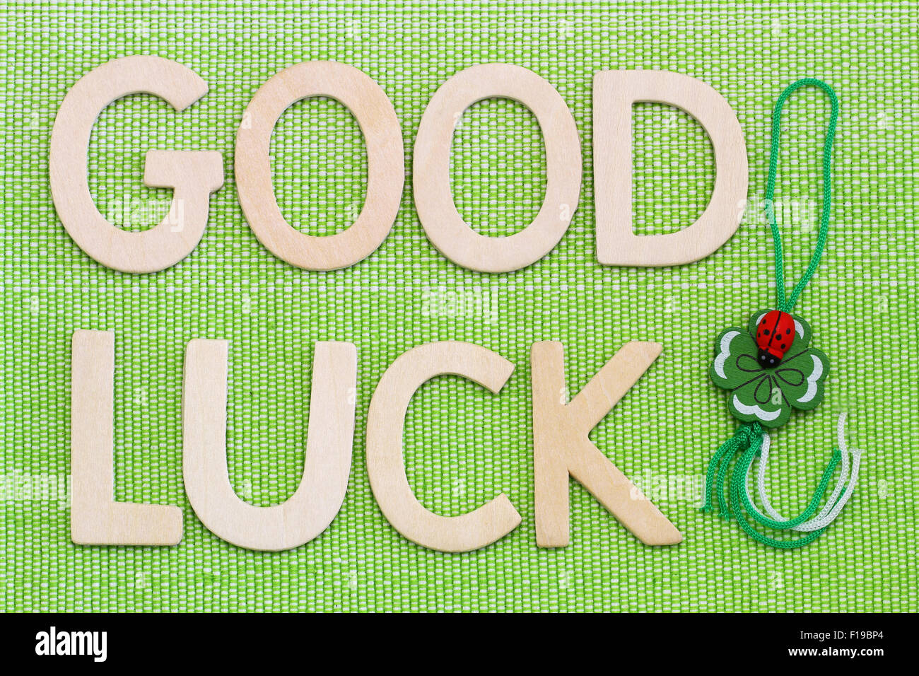 Good luck written with wooden letters and four-leaf clover Stock Photo ...