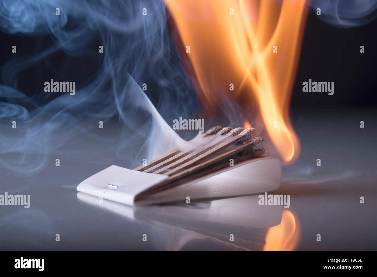 match on fire with dramatic lighting Stock Photo - Alamy