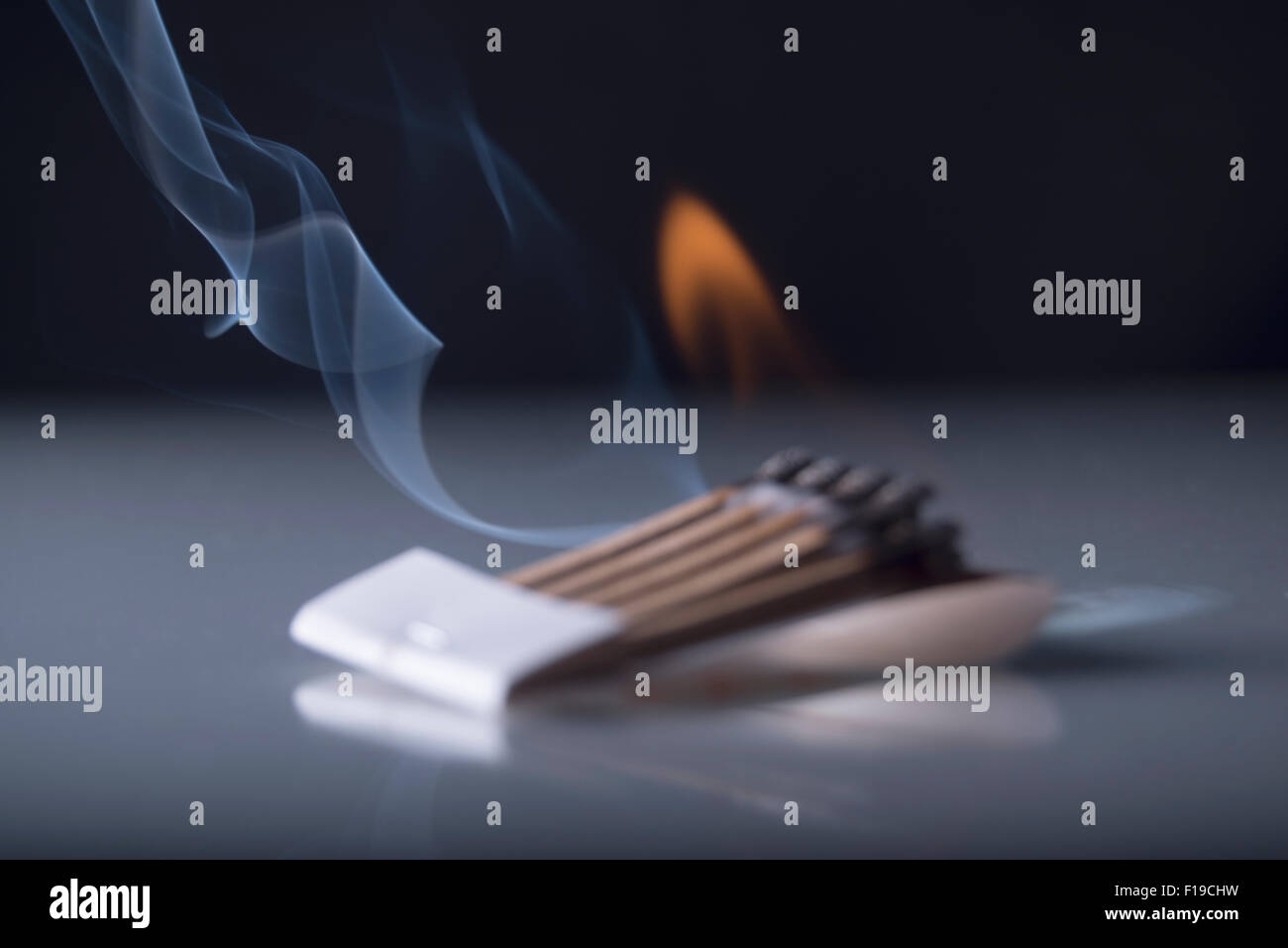 match on fire with dramatic lighting Stock Photo - Alamy