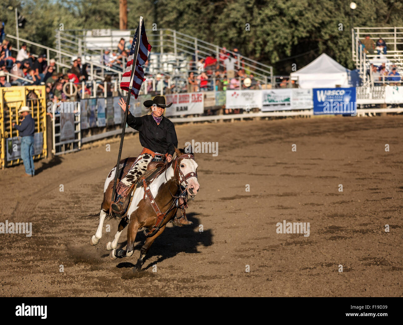 Color guard with American flag at the opening ceremonies of a rodeo ...