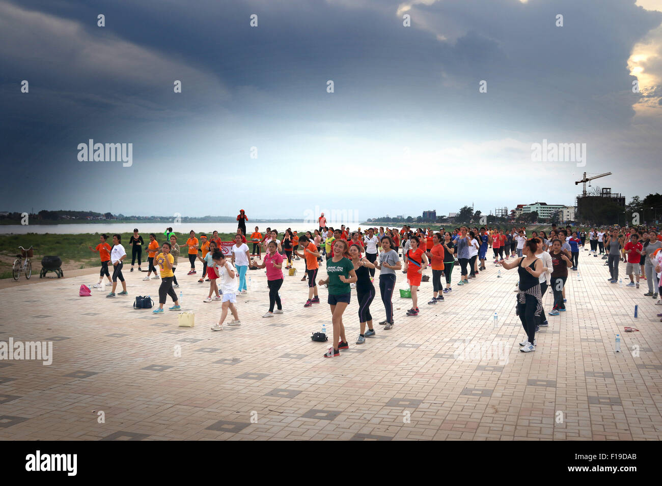 Aerobics exercise keep fit on banks of Mekong River Stock Photo - Alamy