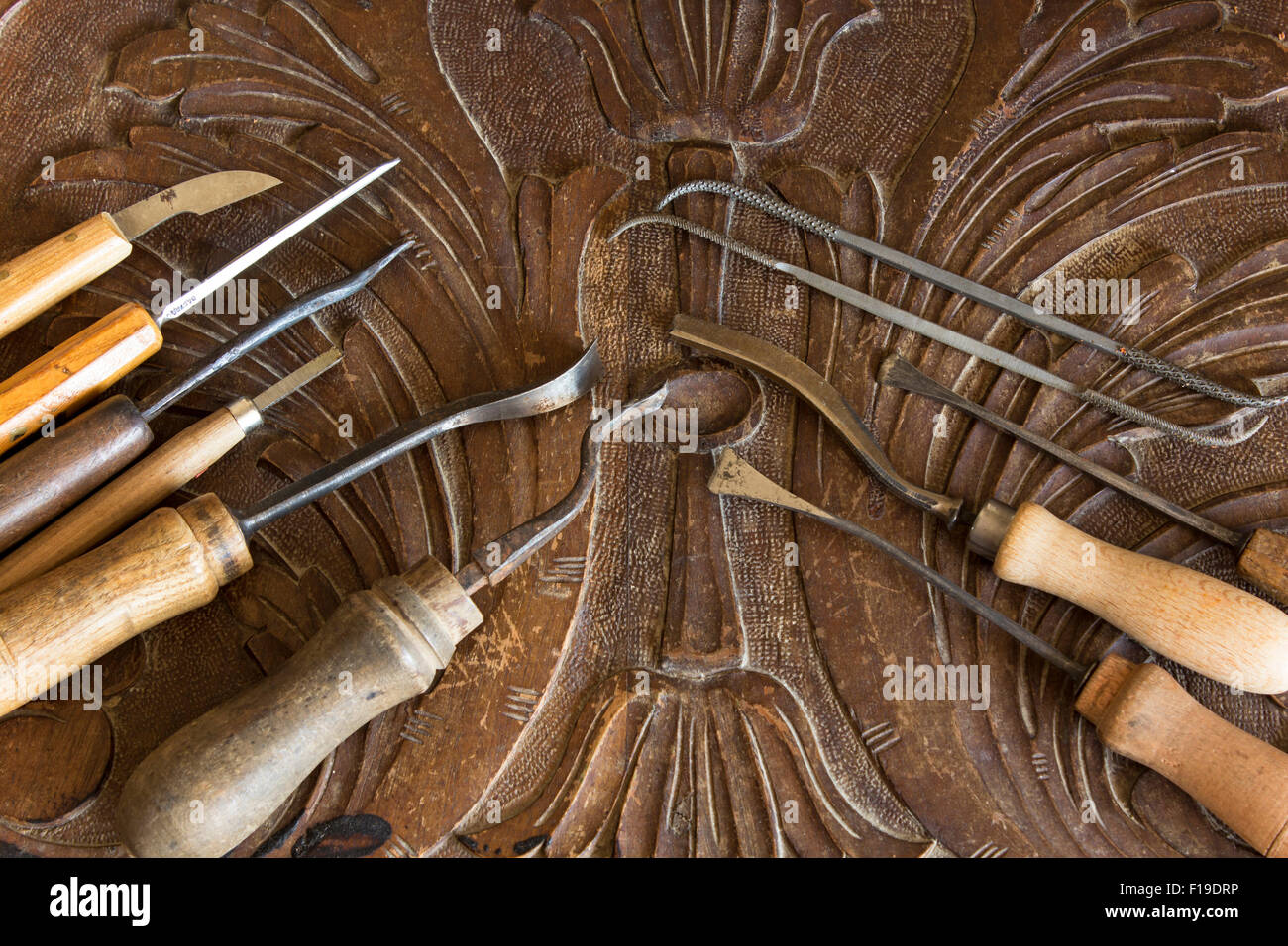 Tools for carving on a carved plank Stock Photo - Alamy