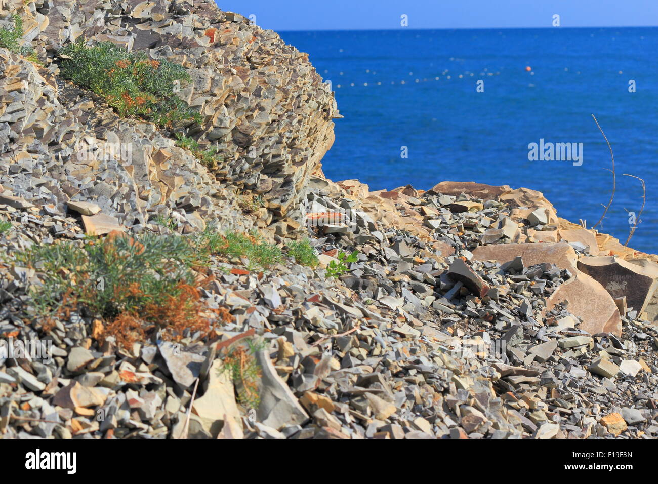 The coastal part of the steep mountain slopes with partially destroyed ...