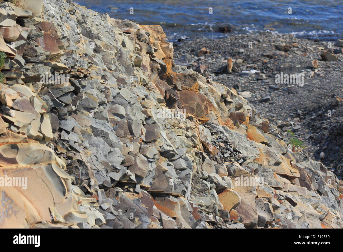 The coastal part of the steep mountain slopes with partially destroyed ...