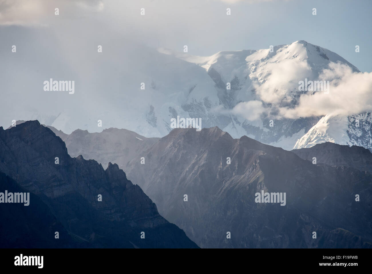 Clouds gather around Mount Blackburn in the Wrangell Mountains at ...