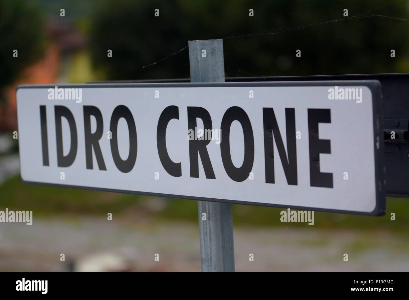 A sign next to the quay of the village "Idro Crone" in Italy, near lake ...
