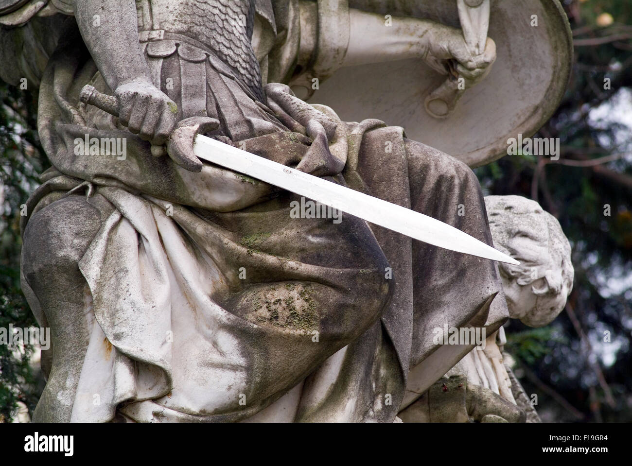 Stone Figurine with sword on Cemetery Stock Photo - Alamy