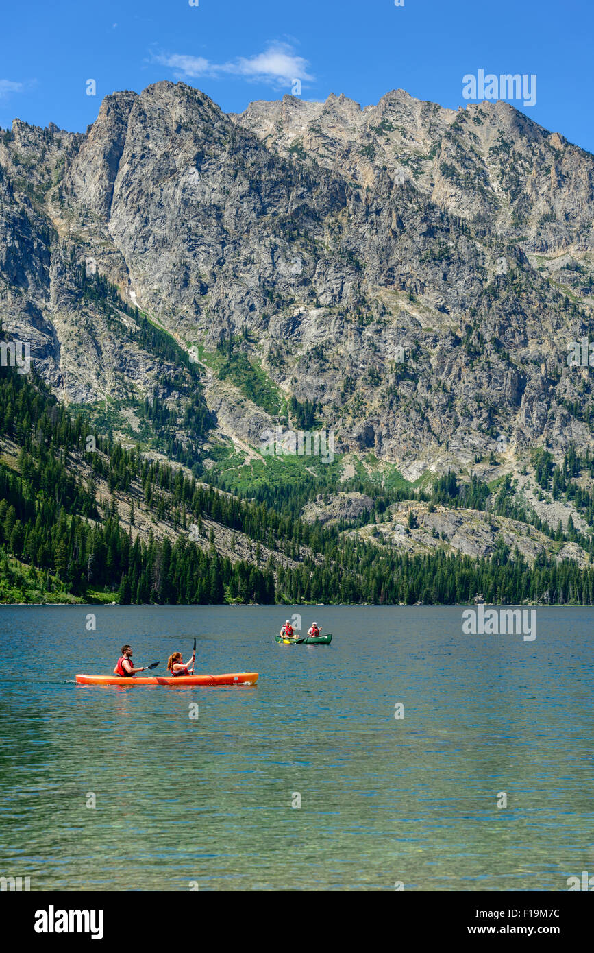 Two people rowing in a kayak during a sunny summer afternoon in Jenny ...