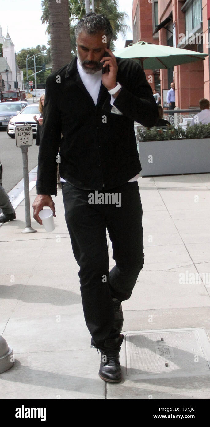 Actor Rick Fox talks on his cellphone as he leaves an office in Beverly ...