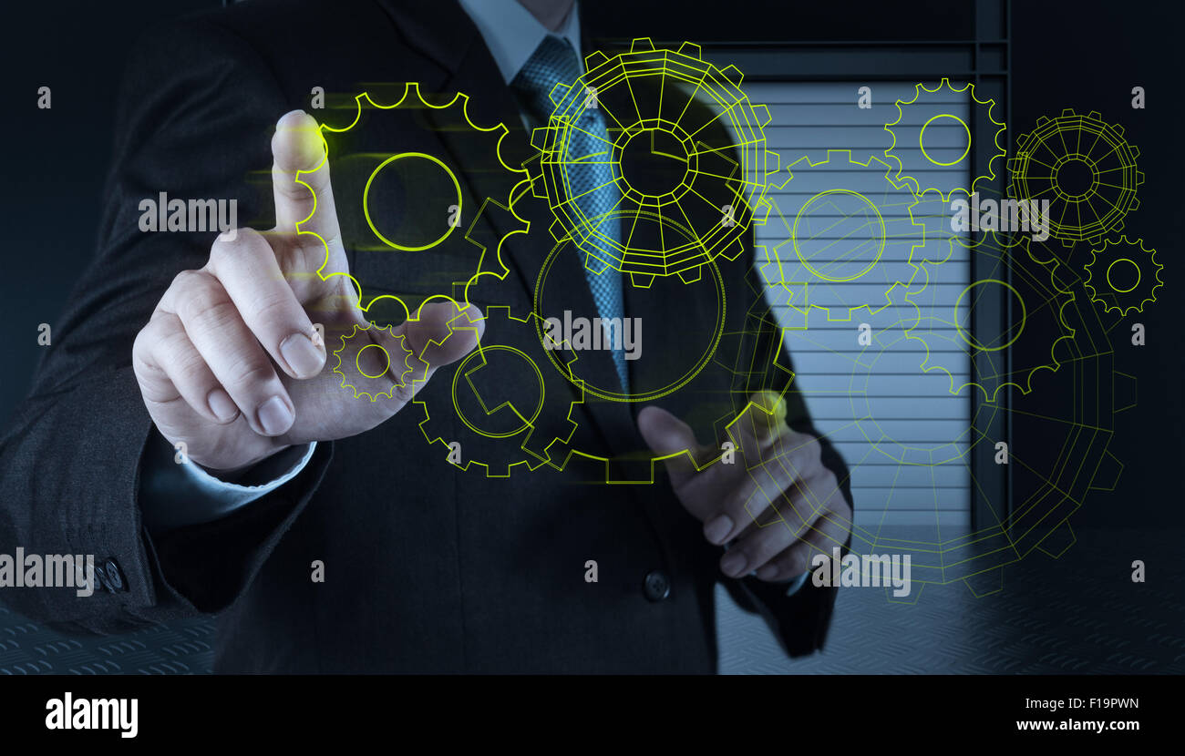 businessman hand draws gear to success concept Stock Photo - Alamy