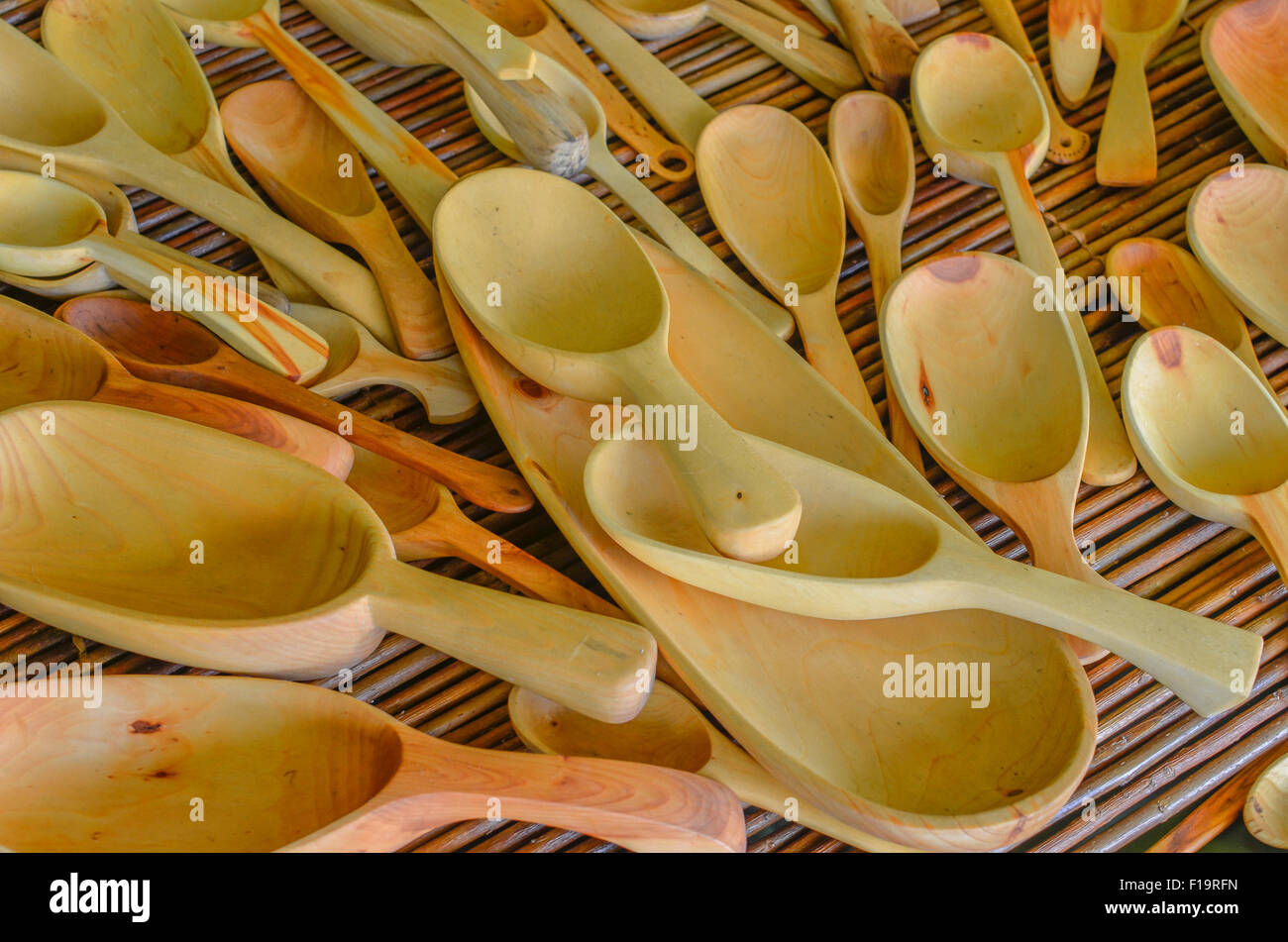 Table covered with examples of hand-carved wooden spoons - a return to ...