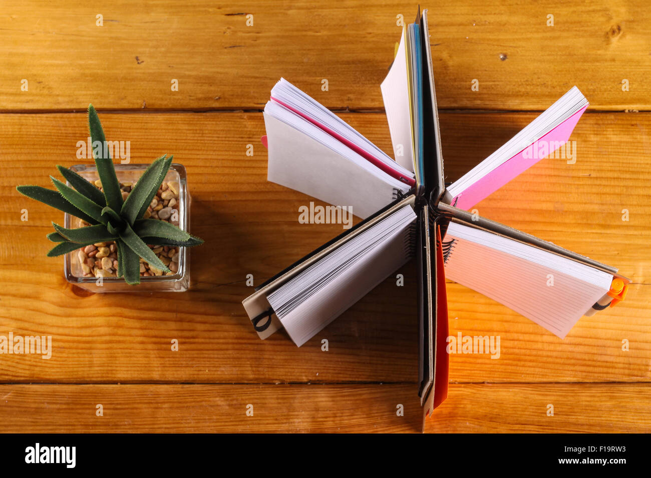 notebook align in star shape on wooden background Stock Photo - Alamy
