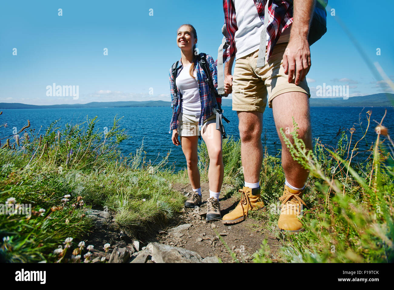 Young travelers hiking in natural environment Stock Photo - Alamy