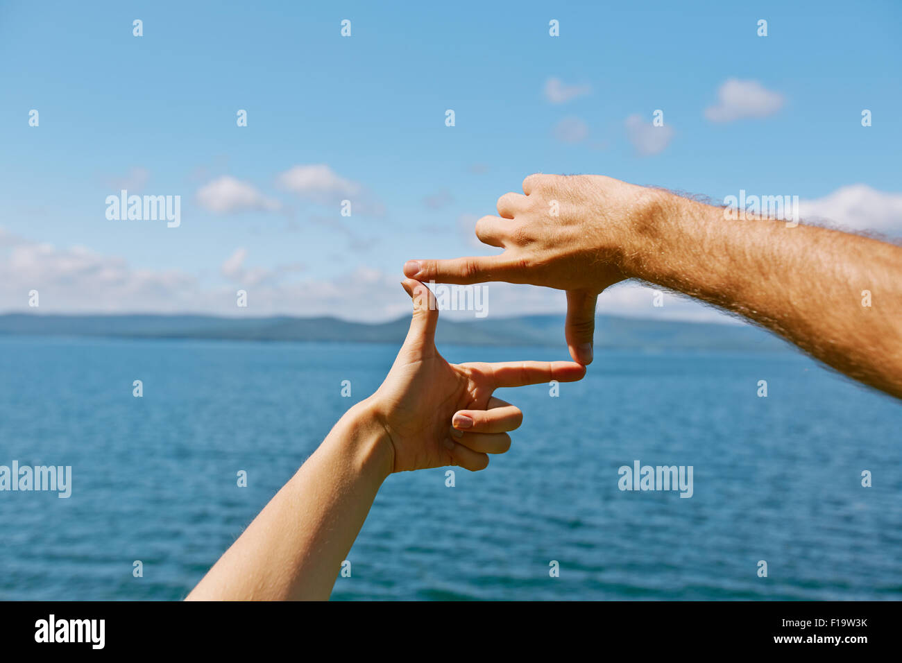 Young man making finger frame hands hi-res stock photography and images ...