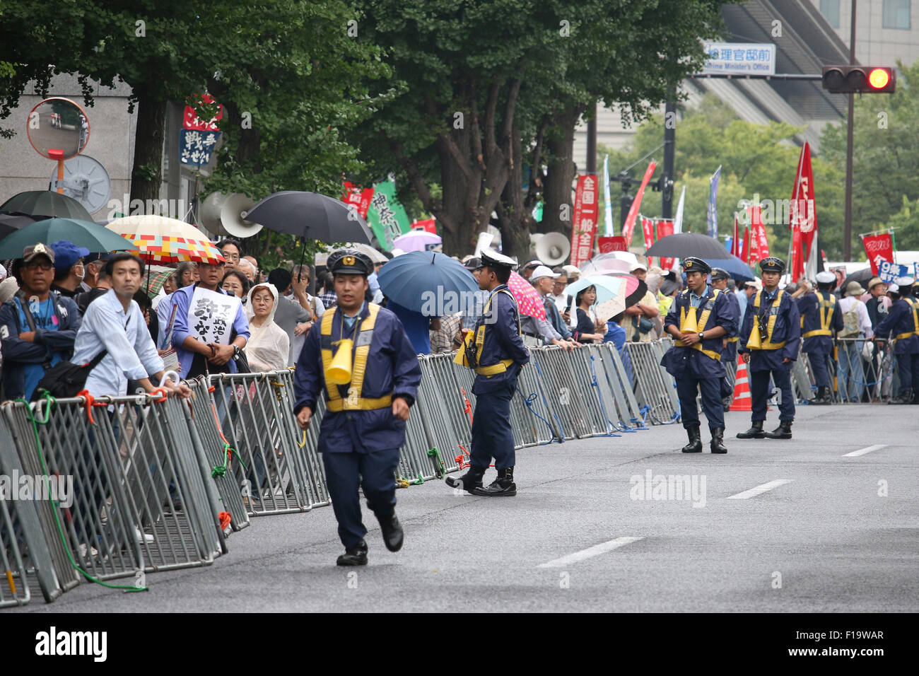 Tokyo, Japan. 30th Aug, 2015. Police officers take their positions as ...