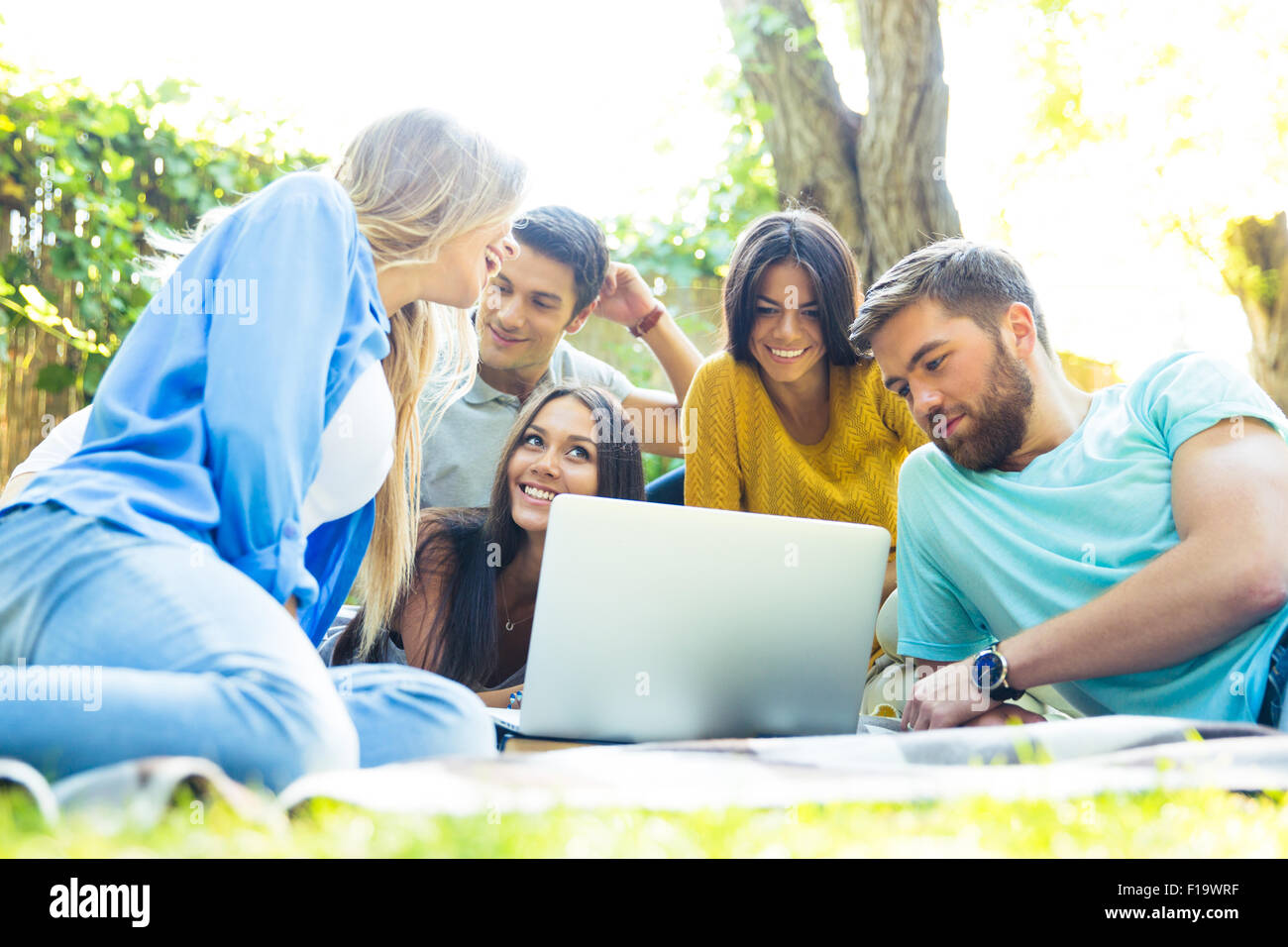 Happy laptop man woman group hi-res stock photography and images - Alamy