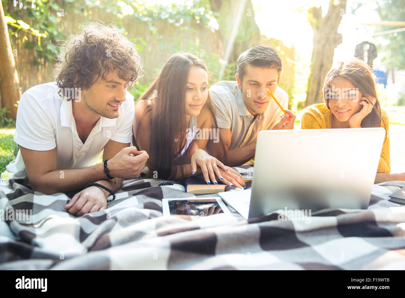 Doing homework with friends hi-res stock photography and images - Alamy
