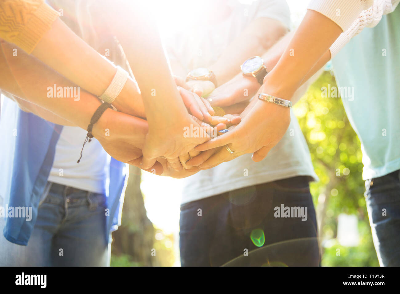 Group of a students hands together Stock Photo - Alamy