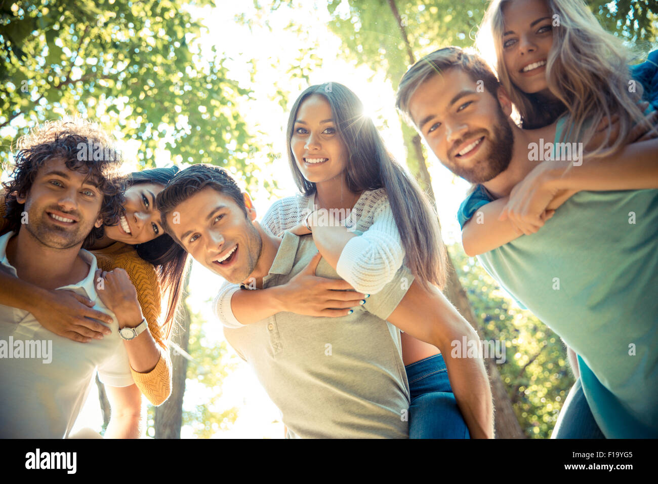 Portrait of a happy friends standing outdoors Stock Photo - Alamy
