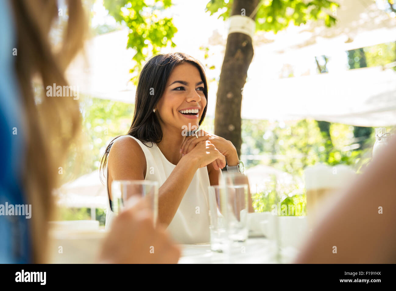 Women laughing restaurant table hi-res stock photography and images - Alamy