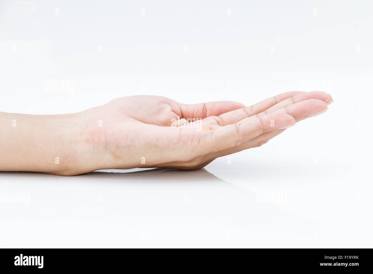 woman hands with open palms over white table Stock Photo - Alamy