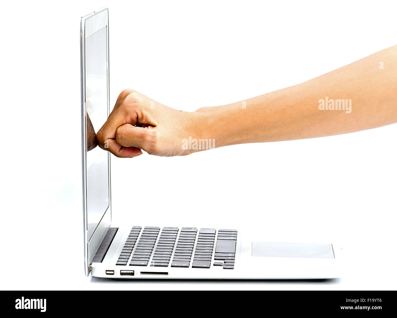 woman fist hit to the monitor of the laptop on white table Stock Photo ...