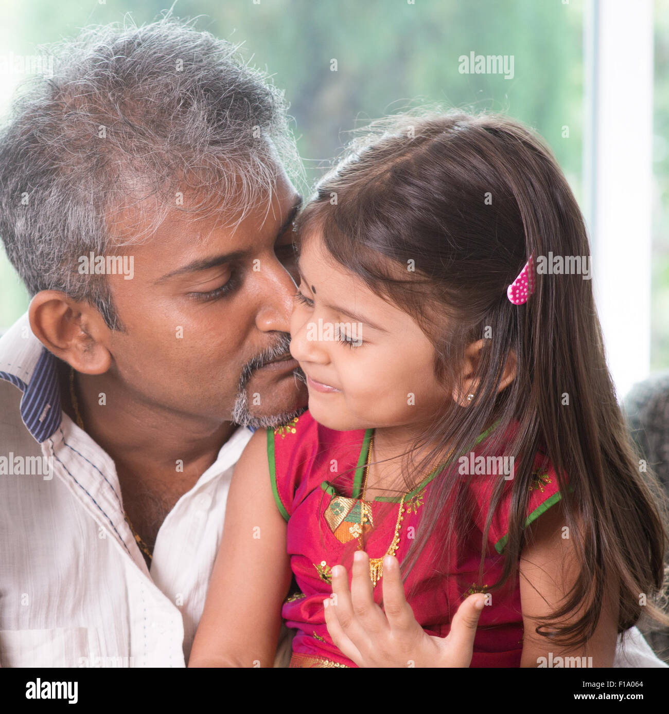 Indian father kissing daughter hi-res stock photography and images - Alamy