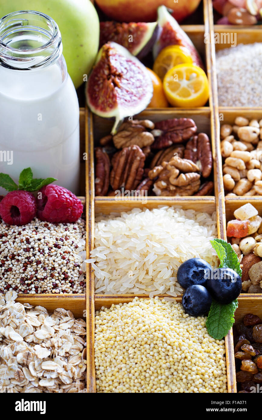 Breakfast items in wooden box with grains and berries Stock Photo - Alamy