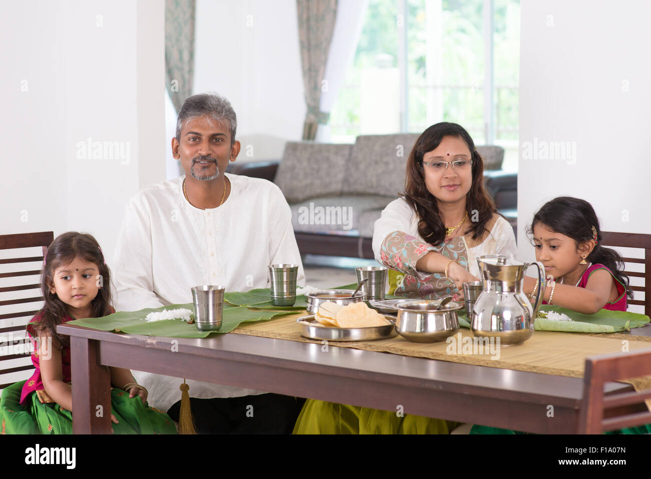 Indian family dining at home. Photo of India people eating rice on ...