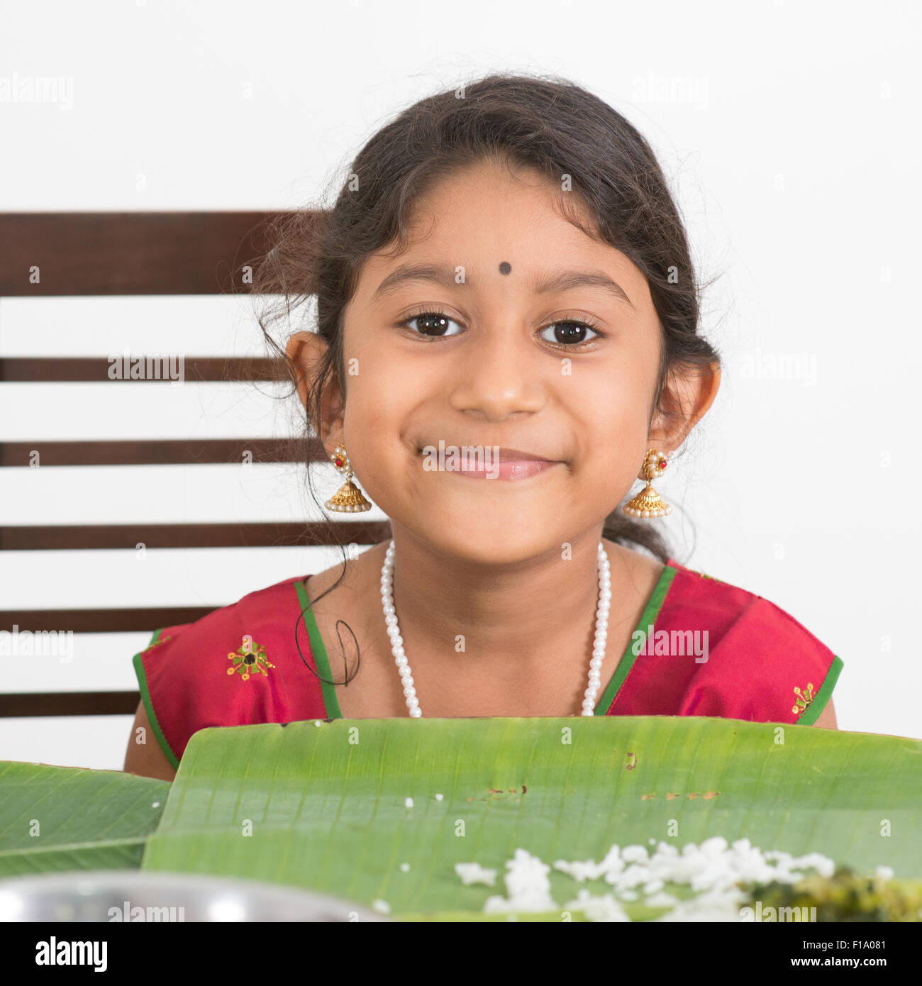Indian child eating rice hi-res stock photography and images - Alamy