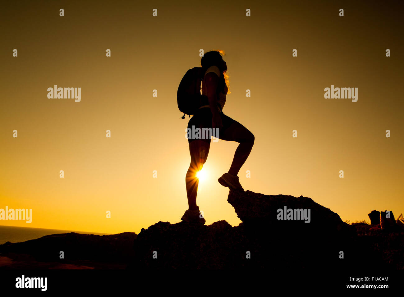 Silhouette of the hiker on sunset Stock Photo - Alamy